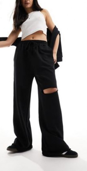 ASOS DESIGN - wide leg sweatpants with ripped knee in black