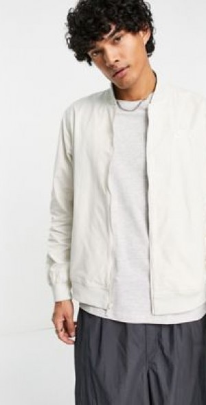 Nike - Club bomber jacket in cream-Brown