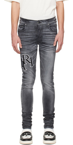 AMIRI - Black Staggered Jeans